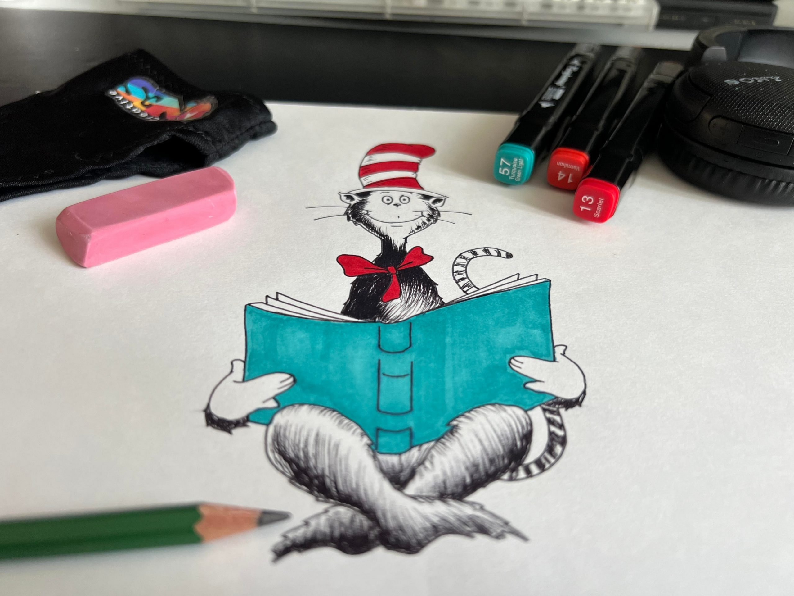 Draw on paper Cat in the Hat reading- Traditional Art